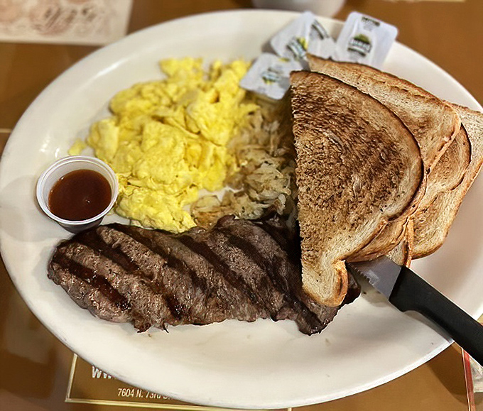 Meal Platter: The breakfast power trio &ndash; perfectly scrambled eggs, seasoned steak, and toast ready for its butter close-up.