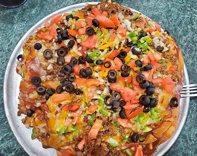 Mexican pizza proving that fusion food can be both delicious and gloriously over the top.
