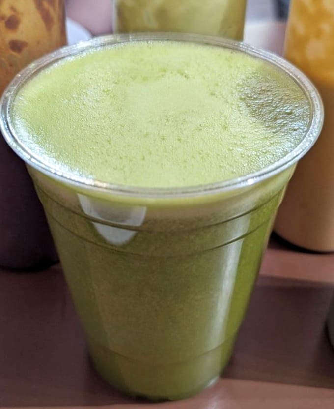 Fresh juice so vibrant it looks like it's glowing with vitamins and good intentions.