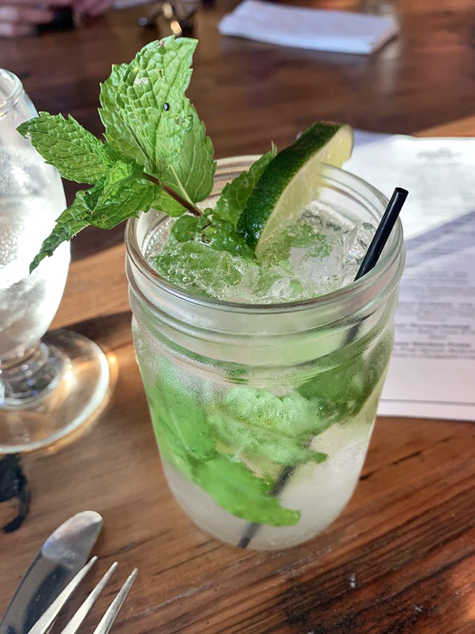 A refreshing mojito garnished with fresh mint and lime, served in a mason jar for that perfect Vermont touch.