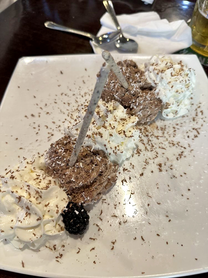 Chocolate mousse that's simultaneously rich and light, topped with fresh whipped cream and a blackberry &ndash; because Europeans understand dessert is serious business.