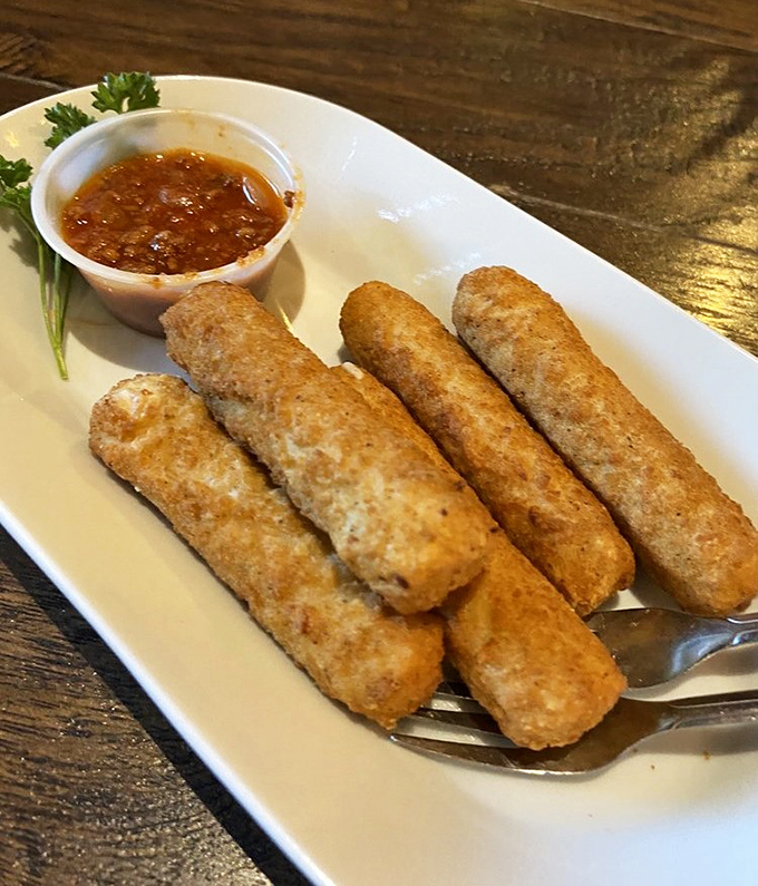 Crispy, golden mozzarella sticks with marinara sauce &ndash; the perfect shareable starter before diving into the main event.