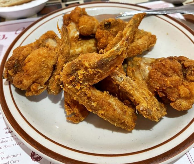 Fried chicken wings that could make Colonel Sanders hang up his apron and admit defeat gracefully.