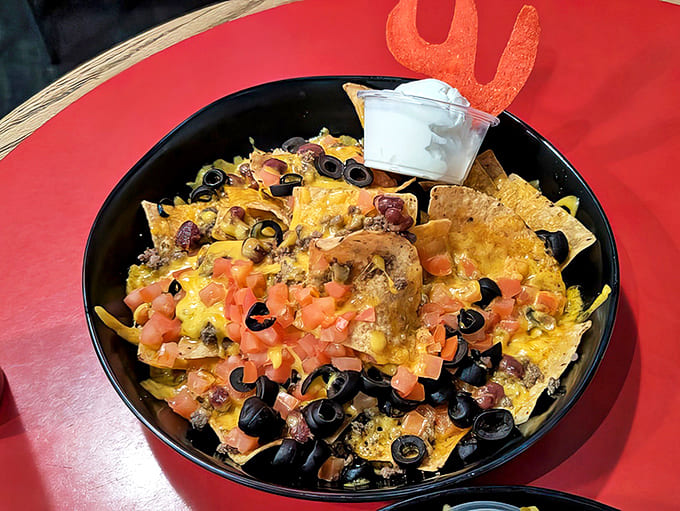 These loaded nachos aren't messing around - every chip is a treasure hunt of toppings.