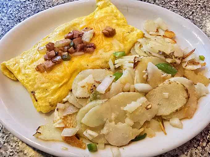 A classic diner breakfast with perfectly cooked eggs and crispy hash browns proves that sometimes simple is absolutely perfect.