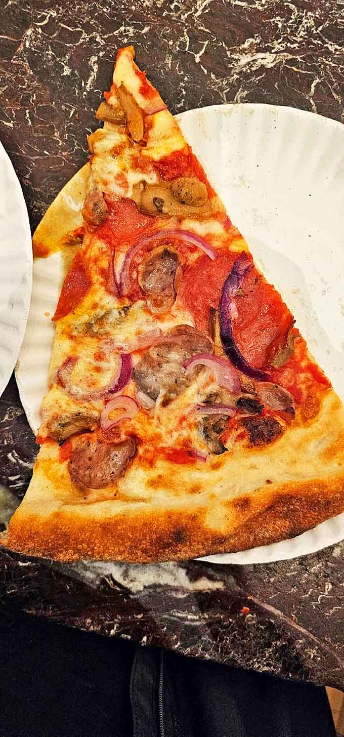 The supreme pizza showcases a harmony of toppings that somehow manages to stay perfectly balanced &ndash; like a delicious game of Jenga.