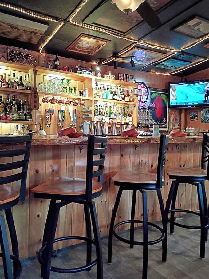 The well-stocked bar area offers a cozy spot to enjoy a drink while you wait for your table and that legendary chowder.