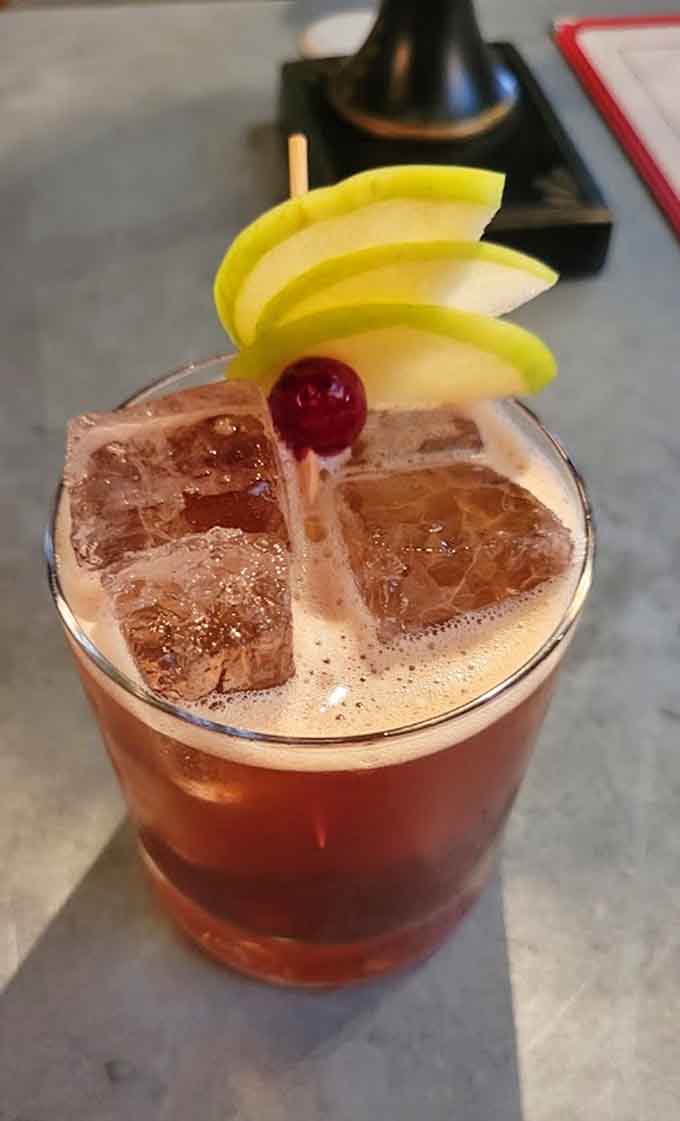 This cocktail arrives dressed to impress with fruit garnishes that could double as a Carmen Miranda tribute act.