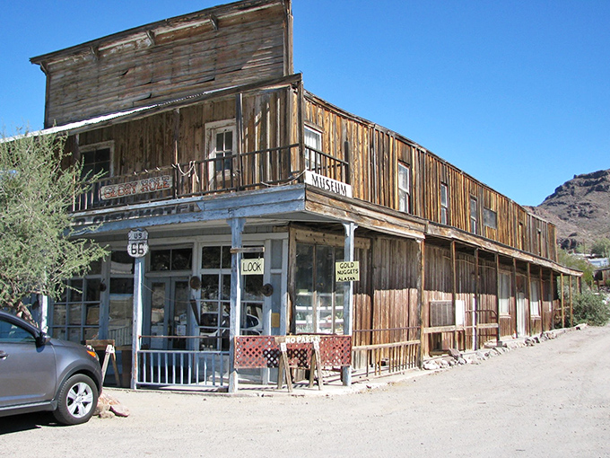 This wooden two-story museum holds the collective memory of Oatman, its weathered boards creaking with stories of boom and bust.