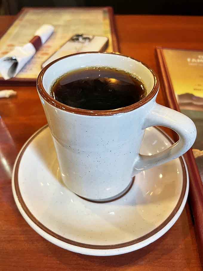 Fresh coffee in a classic diner cup tastes better somehow, especially when refills appear before you even ask for them.