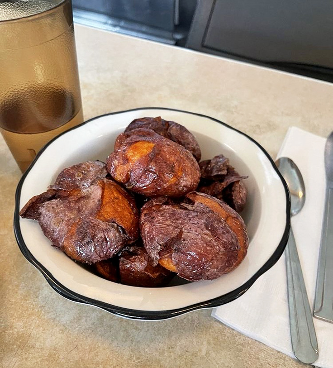 These twice-cooked beauties achieve the impossible – crispy exteriors with creamy centers that make regular home fries seem like sad potato approximations.