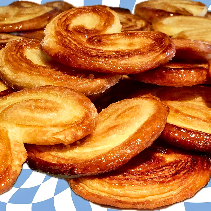 Caramelized palmiers (elephant ears) with their signature swirl &ndash; crispy, buttery, sugary perfection that shatters delightfully with each bite.