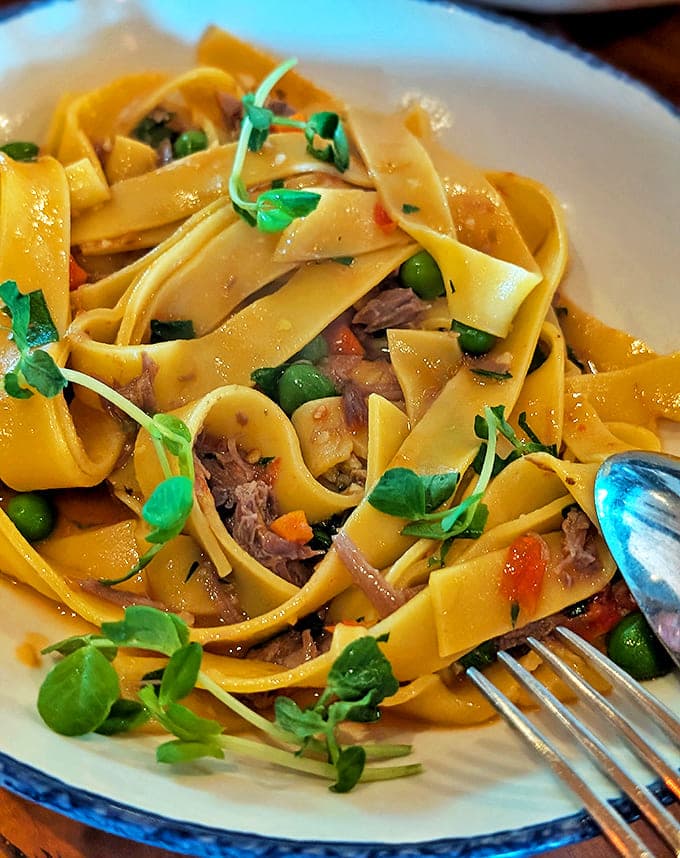 Pappardelle: Golden ribbons of pasta embrace a rich sauce with tender meat. The kind of dish that makes you close your eyes with the first bite.