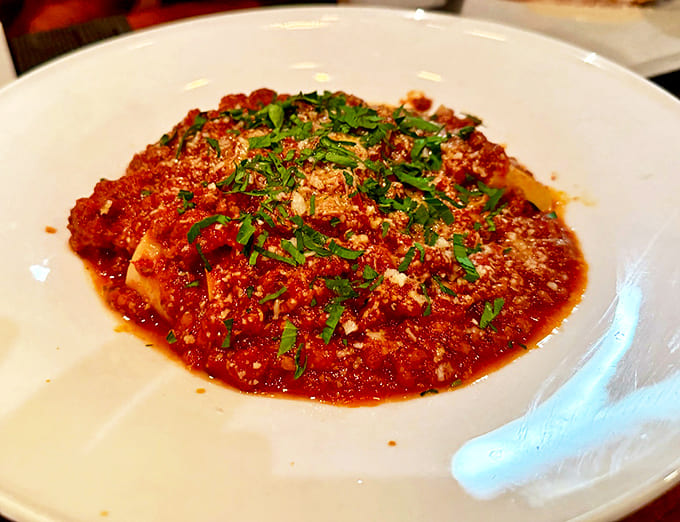 Bolognese that's clearly been simmering since yesterday, developing flavor complexity that makes quantum physics seem simple by comparison.