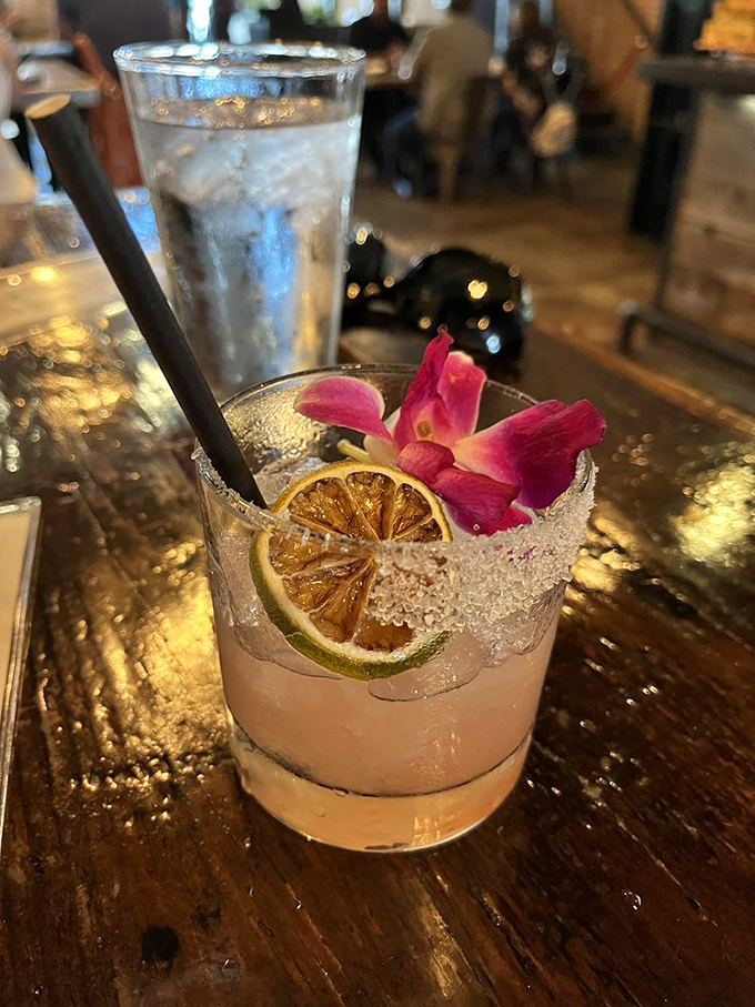 This isn't just a margarita, it's a tropical vacation in a glass, complete with dehydrated citrus and an edible flower lei.