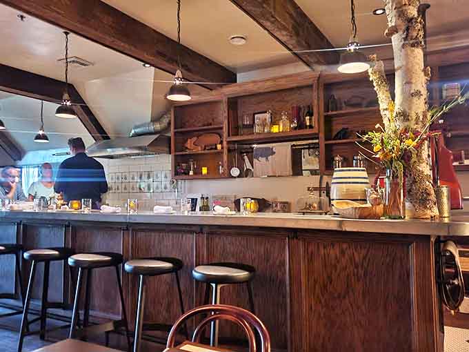 The bar area gleams with bottles and possibilities, staffed by people who know their craft.