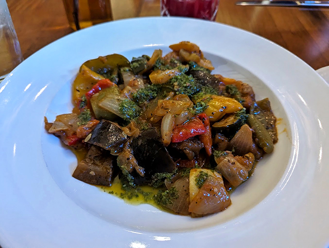 Remy the rat would be jealous of this ratatouille! A rainbow of vegetables dancing in harmony, it's like a Pixar movie come to life on your plate.