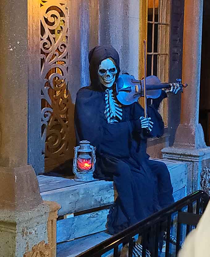 A spectral trick-or-treater waits patiently on the porch, surrounded by jack-o'-lanterns whose grins seem just a bit too knowing.