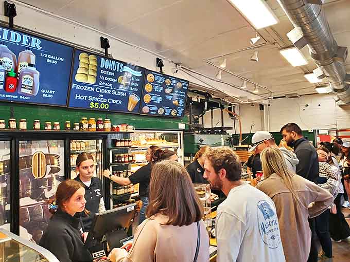 Counter: Where apple dreams come true &ndash; busy staff serving up cider and donuts to eager customers who've been anticipating this moment all year.