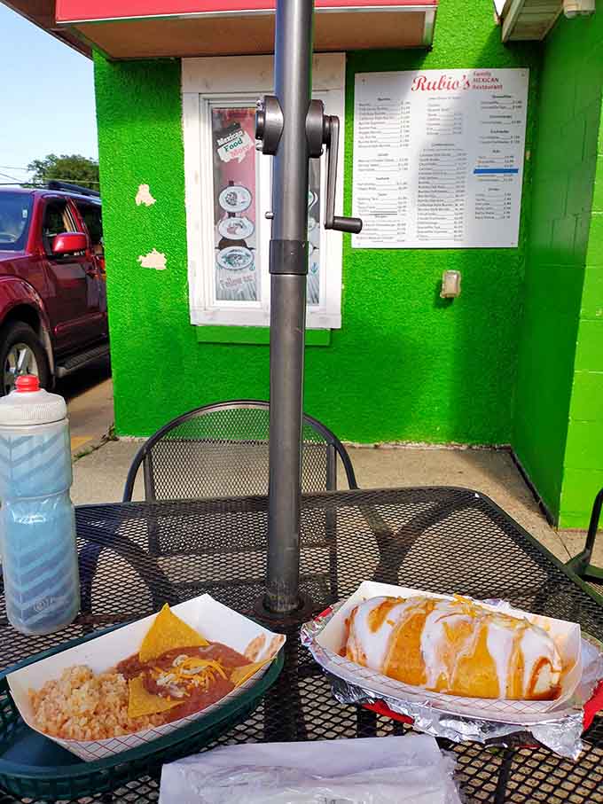 Outdoor dining under umbrellas with food this good makes you wonder why anyone eats inside when weather permits such perfection.