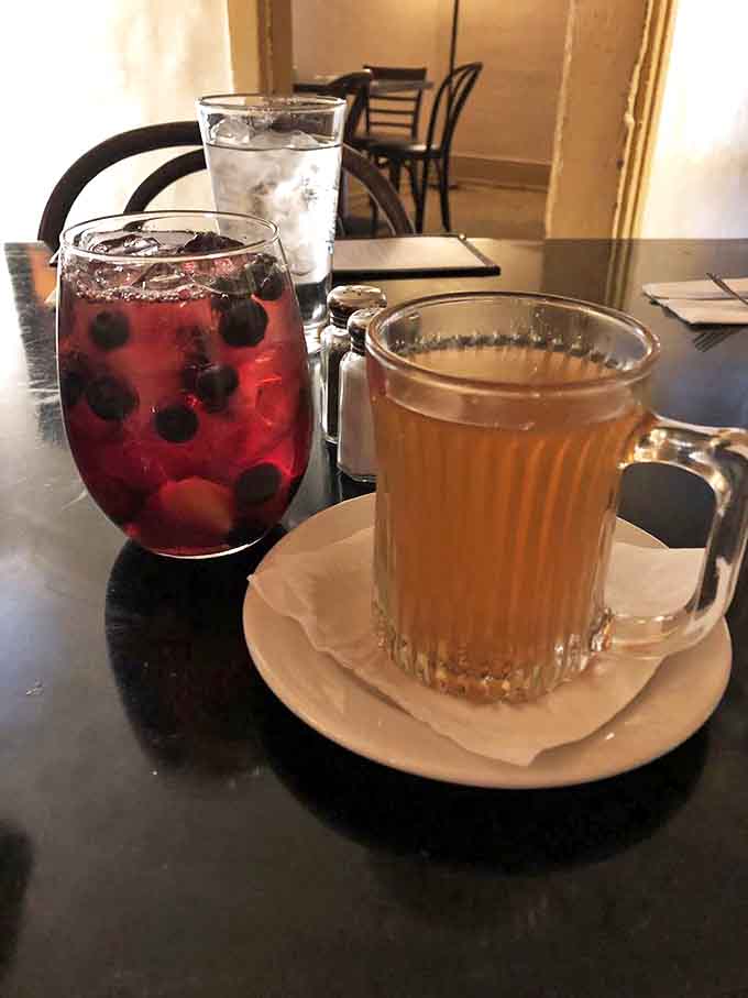 Colorful companions for any meal &ndash; house sangria bursting with fruit alongside a steaming mug of something soothing for the soul.