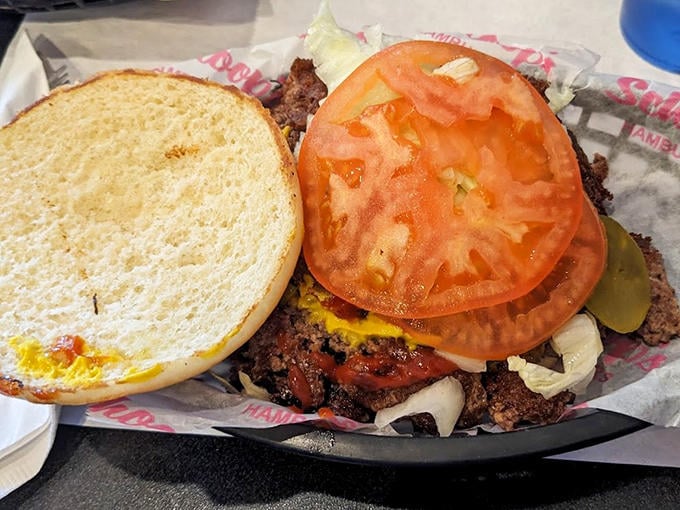 A classic cheeseburger in all its glory, with a thick hand-formed patty, melted cheese, and fresh toppings on a perfectly toasted bun.