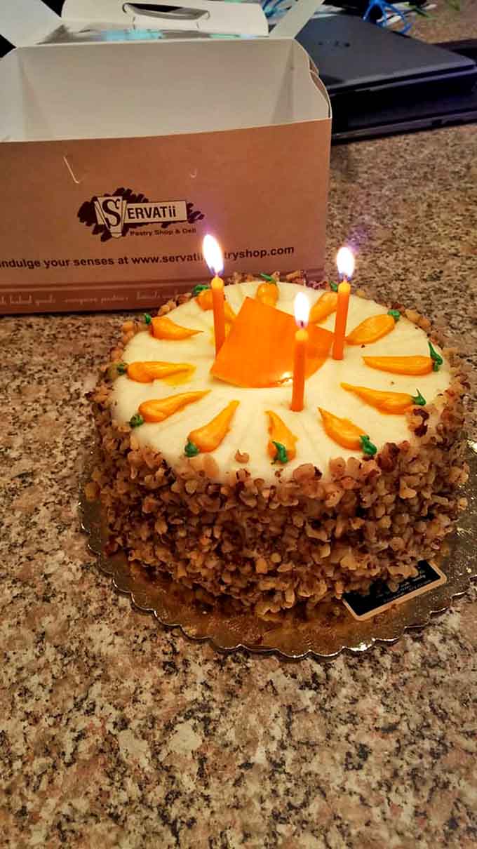 A carrot cake with cream cheese frosting and delicate decorations that's worth celebrating birthdays more than once a year.