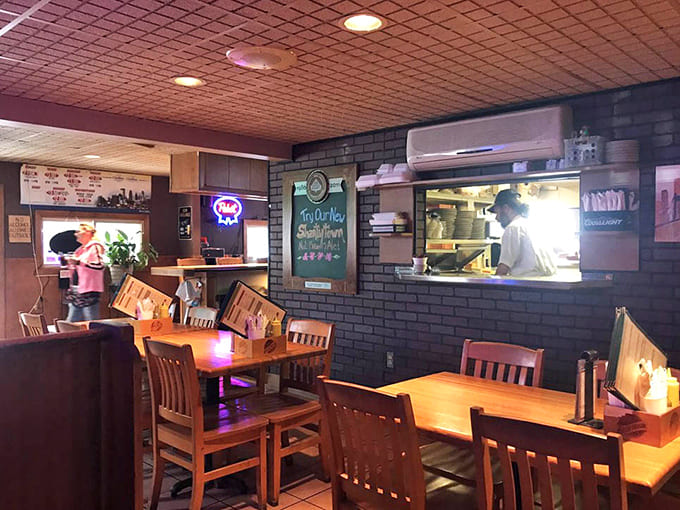 Wooden tables and string lights create an atmosphere where great burgers meet even better company and conversation flows freely.