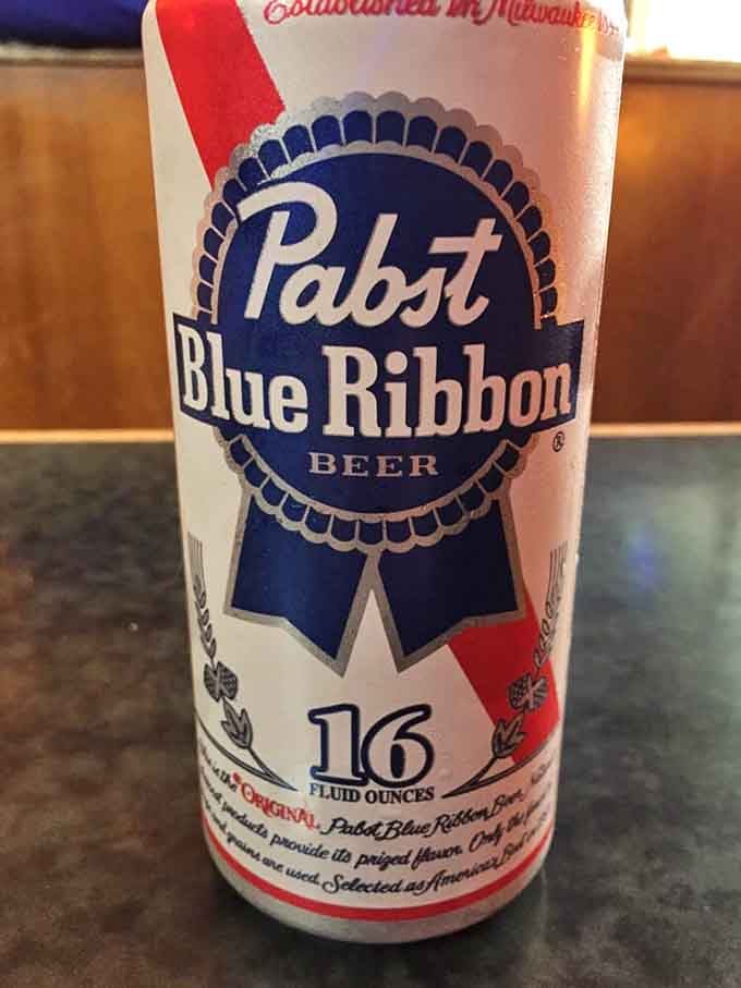 A tall boy of Pabst Blue Ribbon is the perfect no-nonsense beverage choice to pair with your burger and tots.