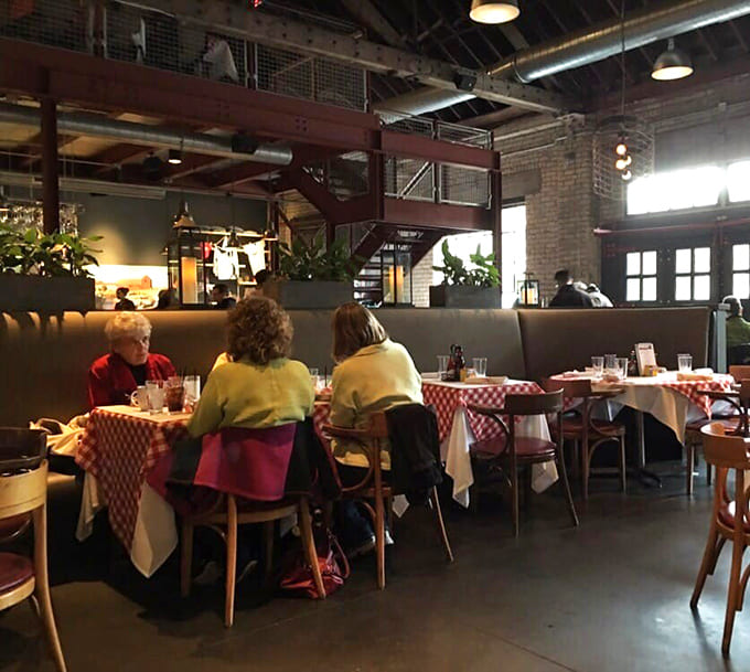 Happy diners dig into their seafood feasts, proving that good food brings people together regardless of how far from the ocean you are.