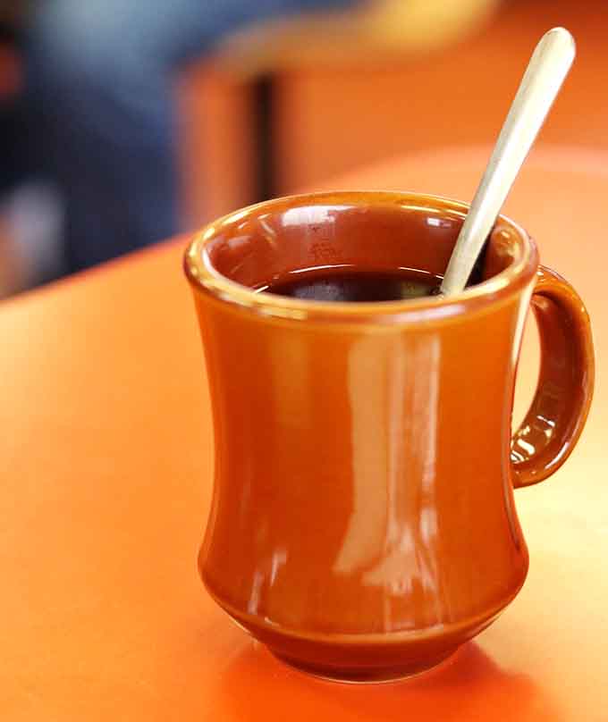 Coffee served in a proper mug that gets refilled without asking: the kind of java that makes mornings make sense.