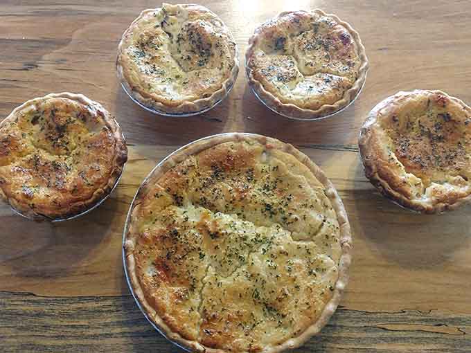Individual chicken pot pies lined up like savory soldiers, ready to deliver comfort in portable, perfectly portioned packages.