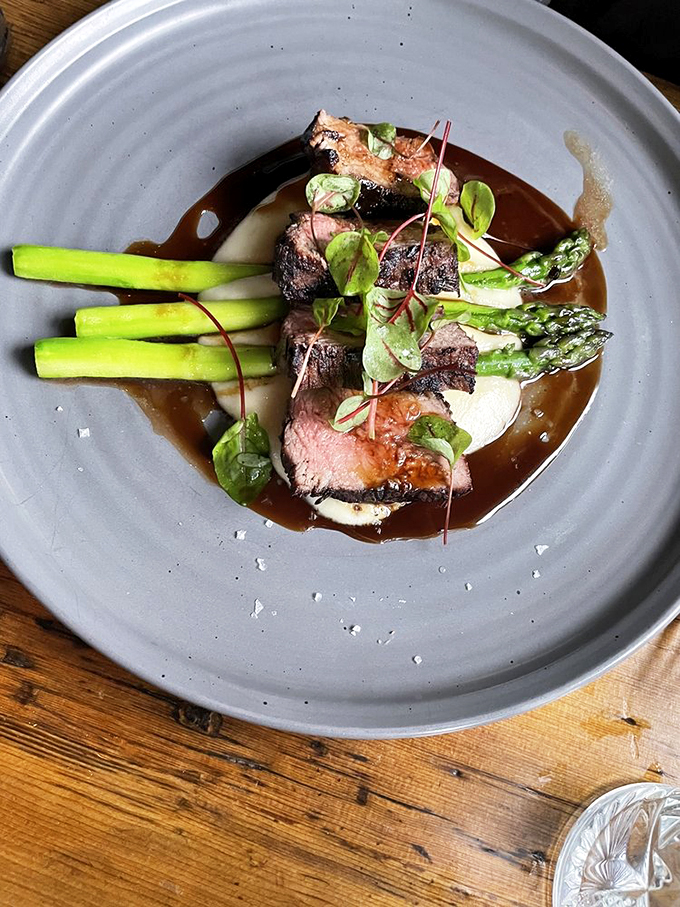 A perfectly cooked steak that would make even Ron Swanson weep with joy. Paired with vibrant asparagus, it's a carnivore's dream come true.