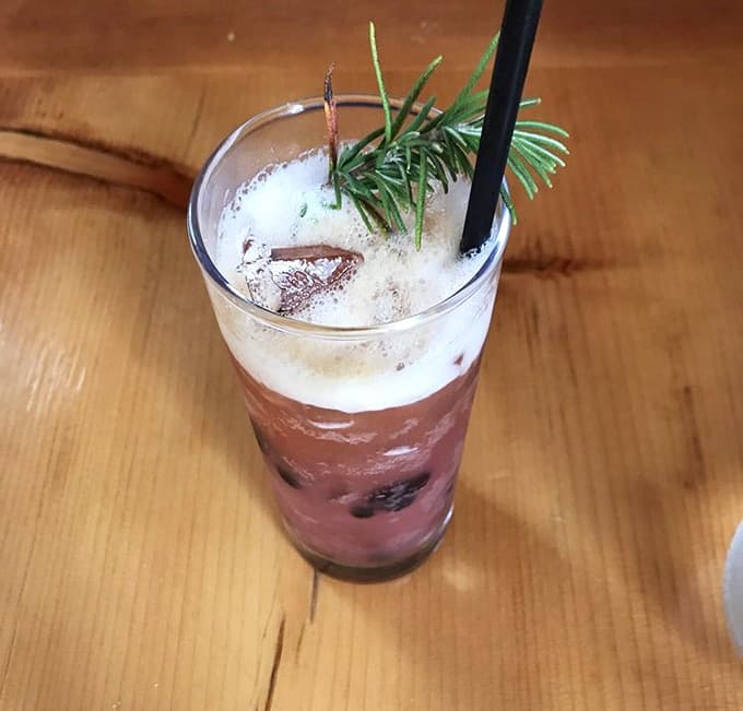 Creative cocktails with fresh herbs show the same attention to detail as the food, because why should pizza have all the fun.