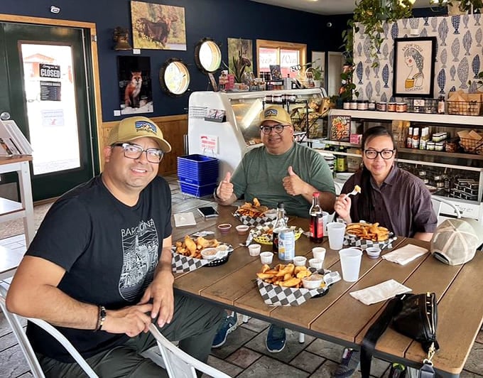 These happy diners know what's up, sharing baskets of crispy seafood and making memories that'll last longer than their food coma.