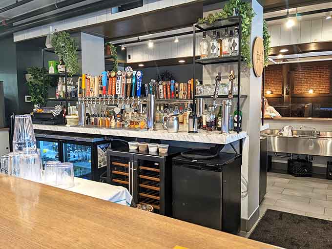 The bar area gleams with possibility, its impressive tap selection suggesting that the beverage program here is serious business done with style.