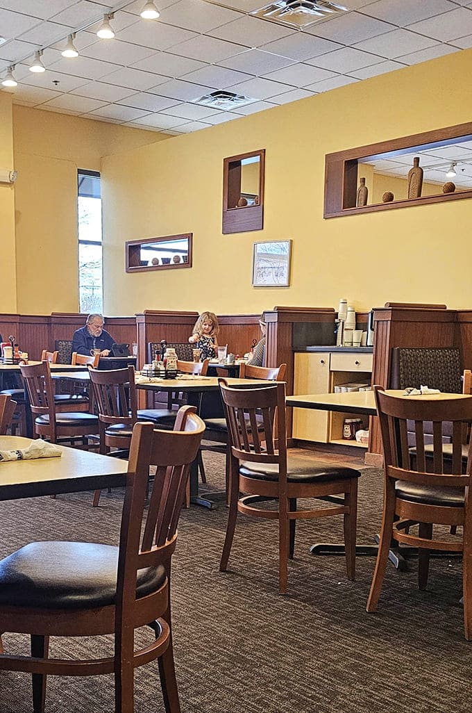 Comfortable booths and tables create an inviting space where morning conversations flow as smoothly as maple syrup.
