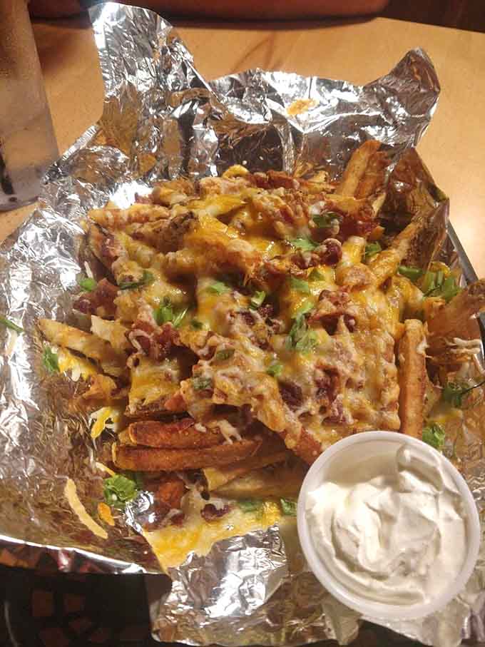 Loaded fries that take comfort food to the next level, piled high with cheese, bacon, and everything good.