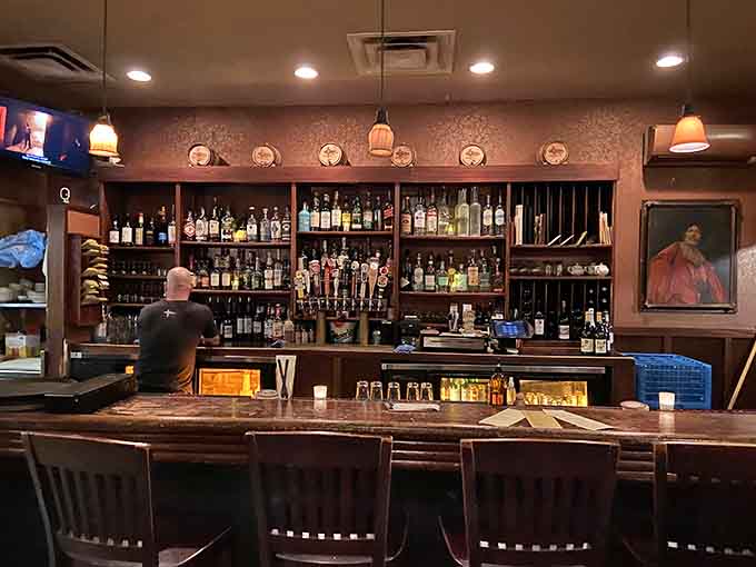 The bar area showcases an impressive bottle collection that promises good times and even better drinks for every preference.