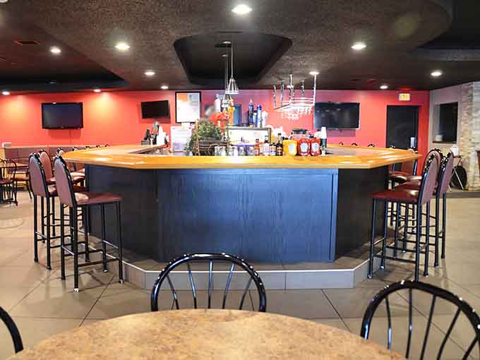 The bar area offers a perfect spot to enjoy a drink while you wait for your order or catch up with friends over appetizers.
