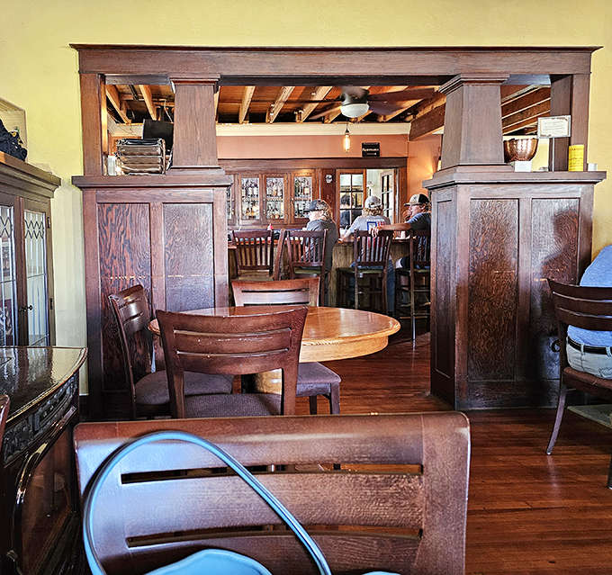 Dark wood and warm lighting create the kind of atmosphere where time slows down and second helpings seem like excellent ideas.