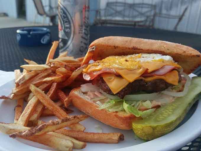 This towering burger creation topped with bacon and a fried egg takes indulgence to delicious new heights.