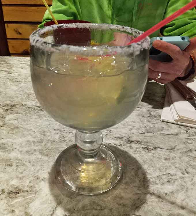 This margarita with its salt-rimmed glass looks ready to complement whatever deliciousness you've ordered from the kitchen.