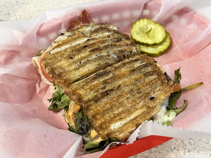 A perfectly pressed Turkey Club that proves The Fountain isn't just about desserts &ndash; savory offerings get the same attention to detail as the sweet.