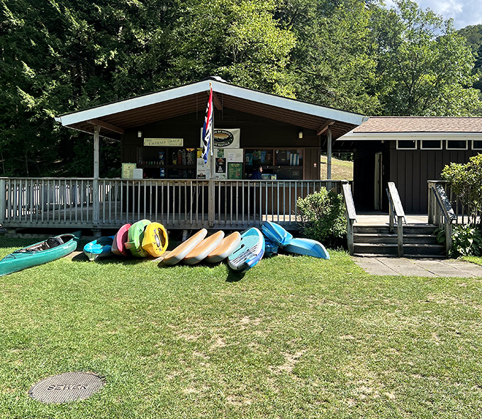 The visitor center welcomes adventurers with local knowledge, essential supplies, and colorful watercraft ready for lake exploration.
