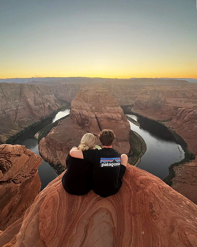 Love and landscape merge at sunset, as visitors find the perfect spot to witness nature's grandest show.