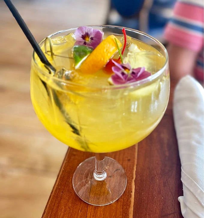 Summer in a glass &ndash; golden liquid adorned with edible flowers and fresh fruit, making ordinary drinks seem positively underdressed.