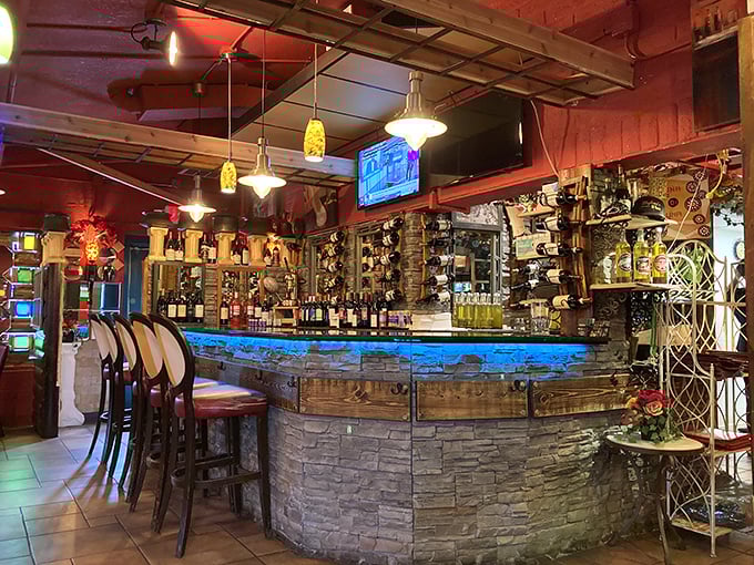 Luna di Luna's bar glows with blue ambiance, showcasing an impressive wine selection that pairs perfectly with their legendary pasta.
