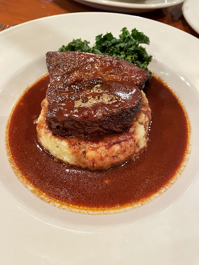 Fork-tender braised short ribs rest atop creamy mashed potatoes, surrounded by a sauce so good you'll want to drink it.