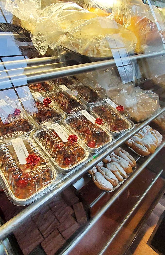 The cake display offers a rainbow of options, from pineapple upside-down cakes to chocolate creations that make special occasions even more memorable.